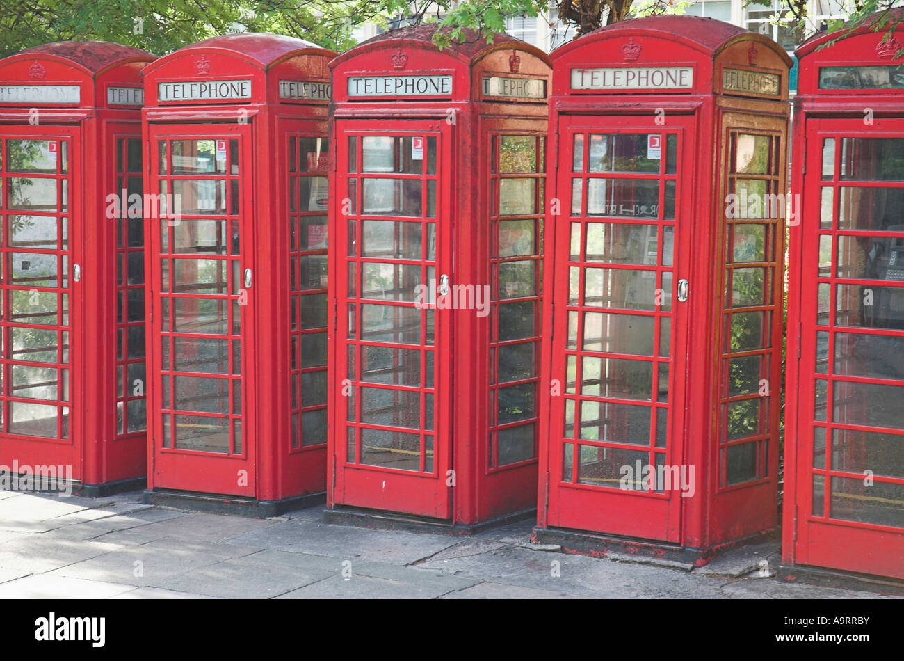 Row of classic British public pay phone boxes Stock Photo - Alamy