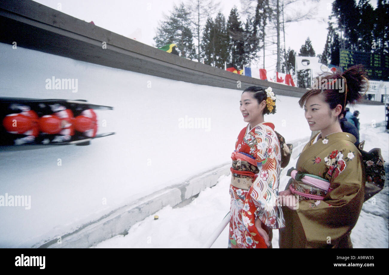 TWO GEISHA WATCH THE SPORT AT THE OLYMPIC BOBSLEIGH TRACK NAGANO Stock ...