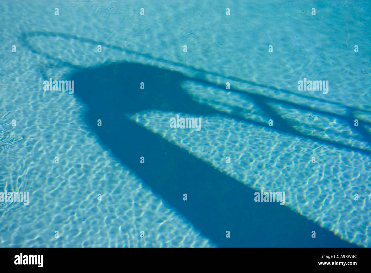 Shadow of a water slide in a swimming pool Stock Photo - Alamy