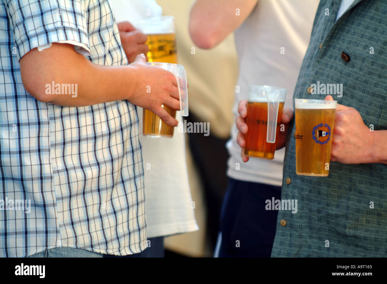 drinkers beer bellies men session lager Stock Photo - Alamy
