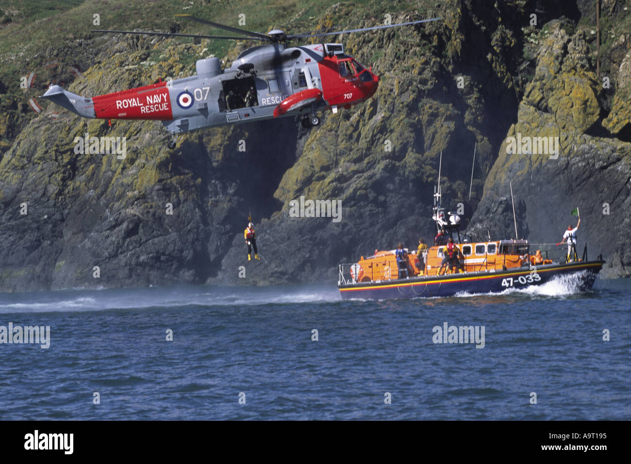 Sea rescue by helicopter and lifeboat, cliffs near Portpatrick Scotland ...