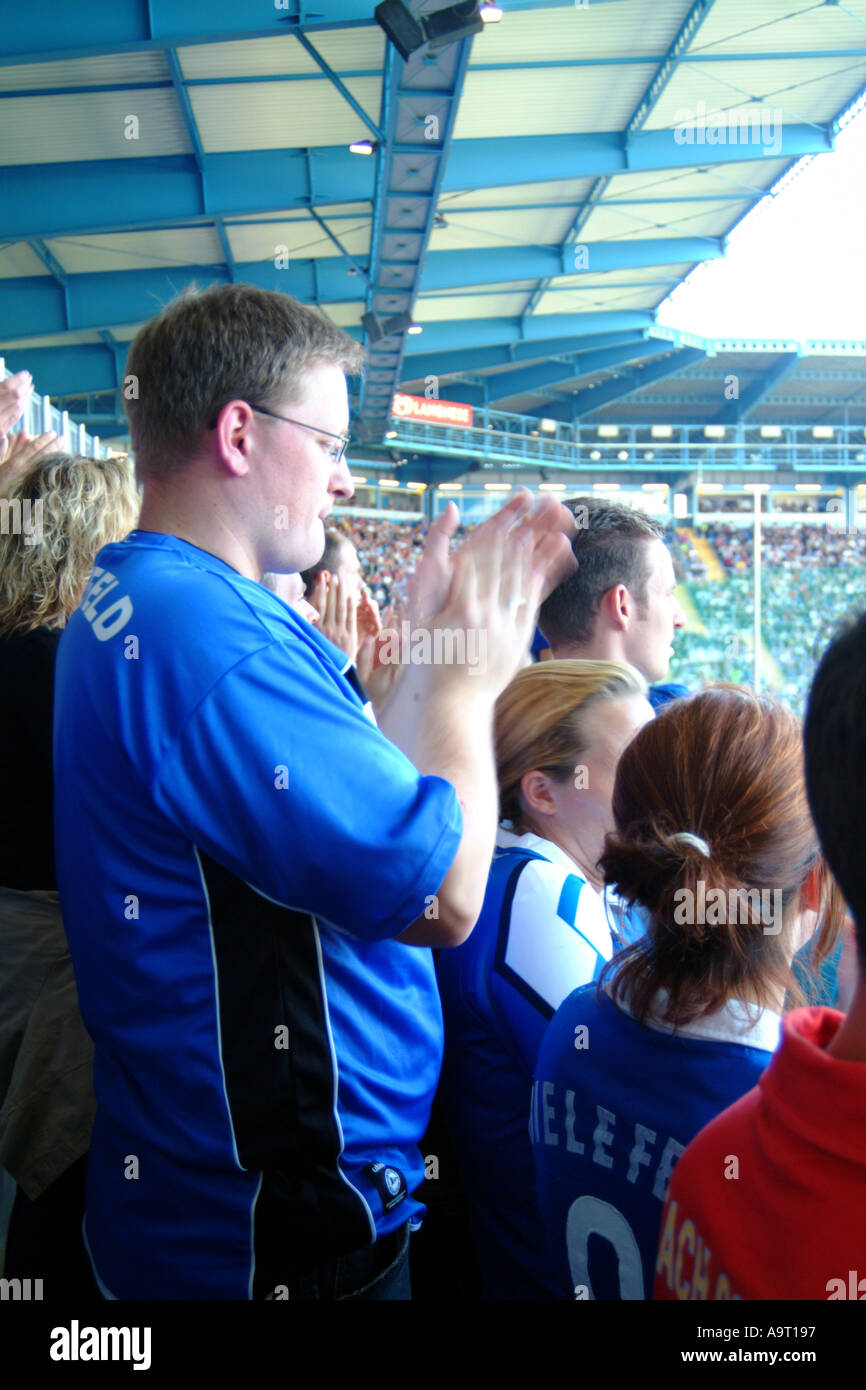 Football fans cheering rear view hi-res stock photography and images ...