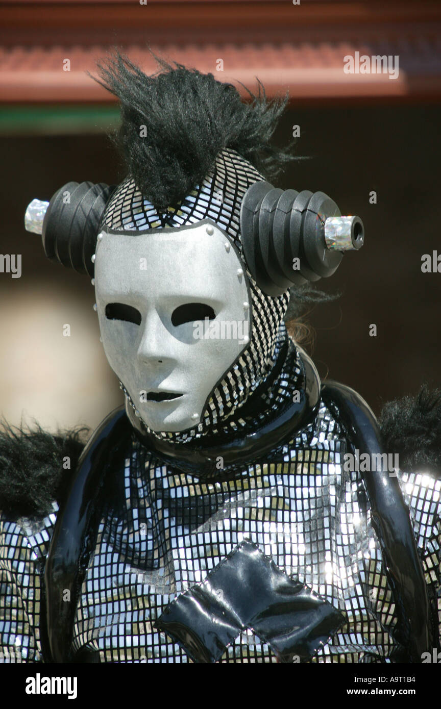 An entertainer dressed as a space age robot complete with mask Stock ...