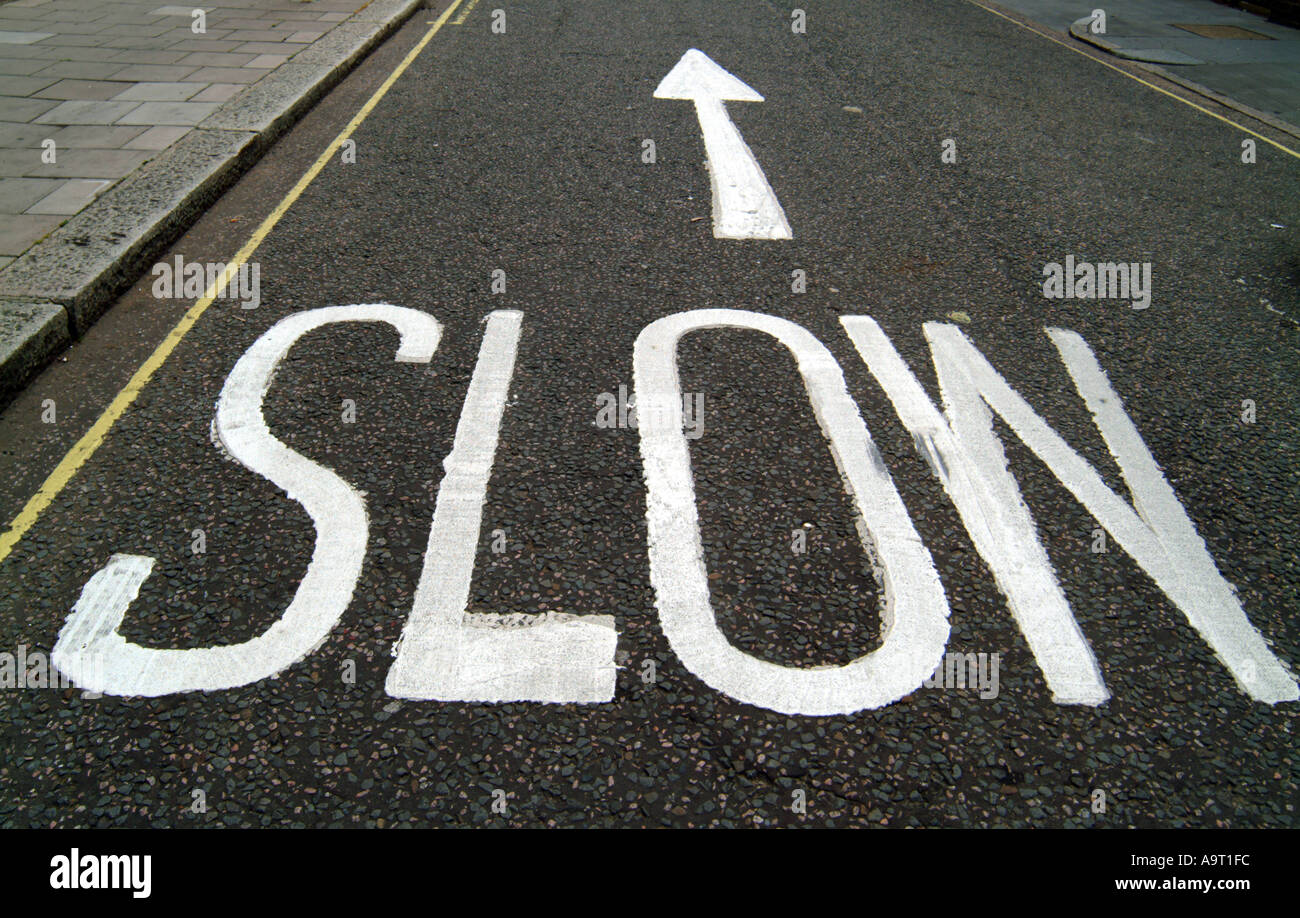 road slow arrow Stock Photo - Alamy
