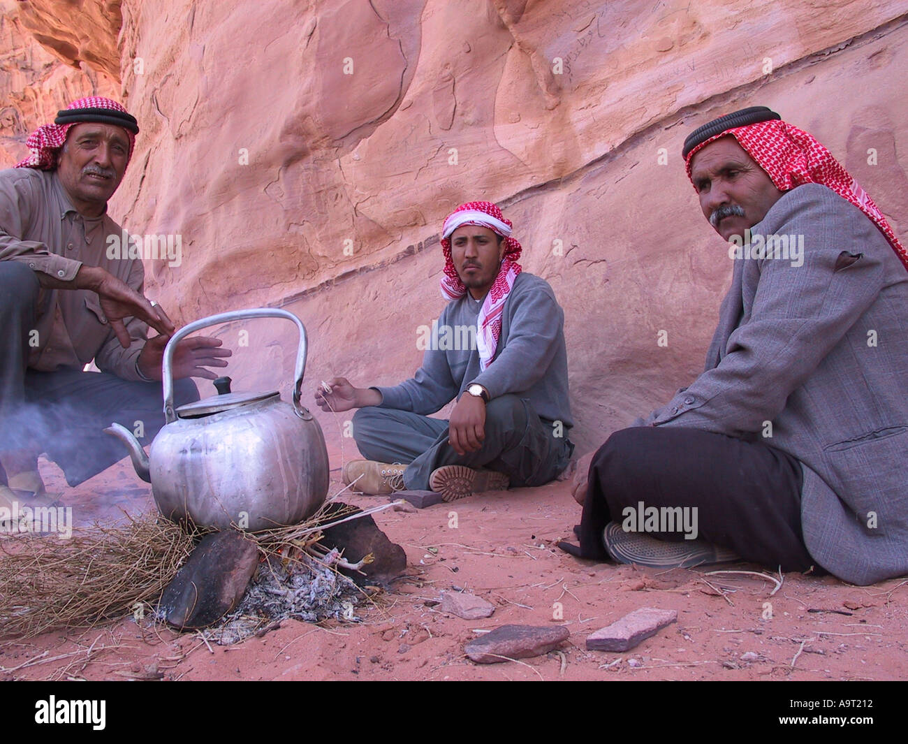 Bedouin brewing tea in desert Stock Photo - Alamy