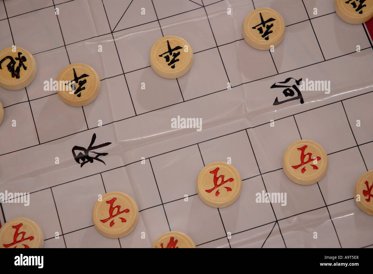 Traditional Chinese chess pieces laid on the board Stock Photo - Alamy