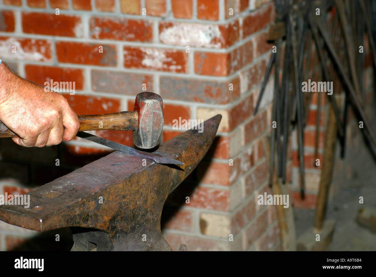 Horizontal Blacksmith at work Stock Photo - Alamy