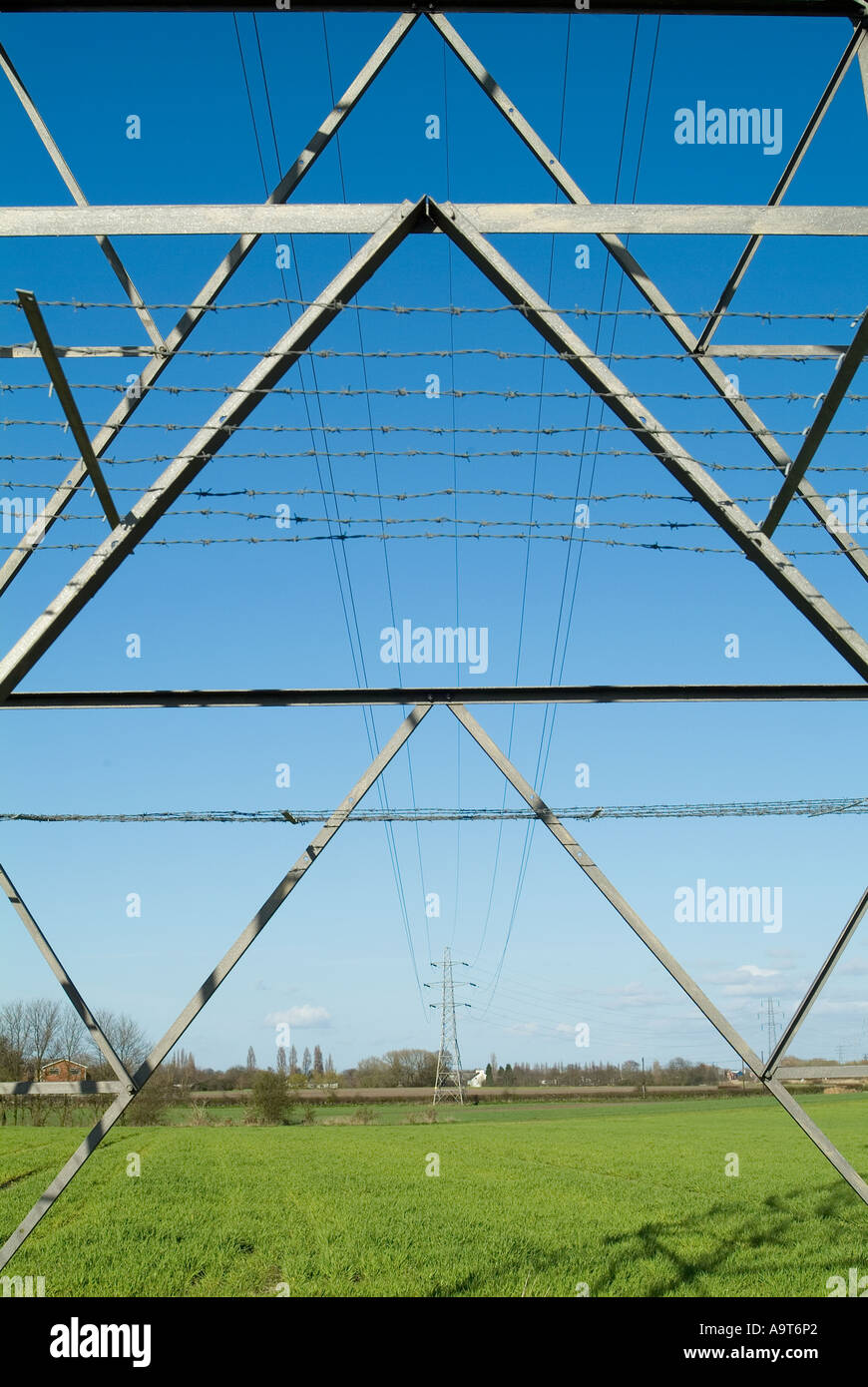 Electricity Pylon viewed through the legs of another pylon Stock Photo ...