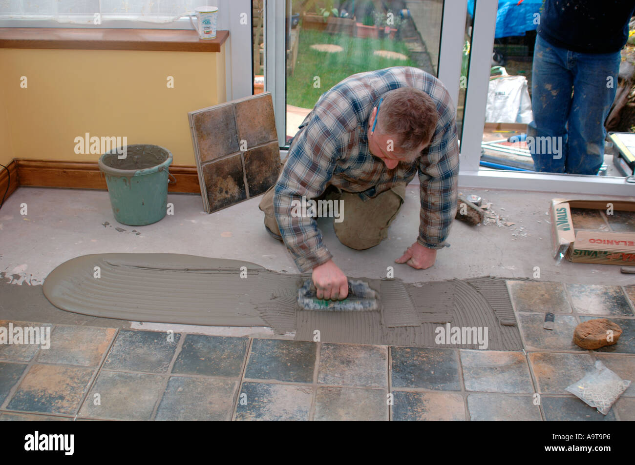 Fitting Floor Tiles Stock Photo - Alamy