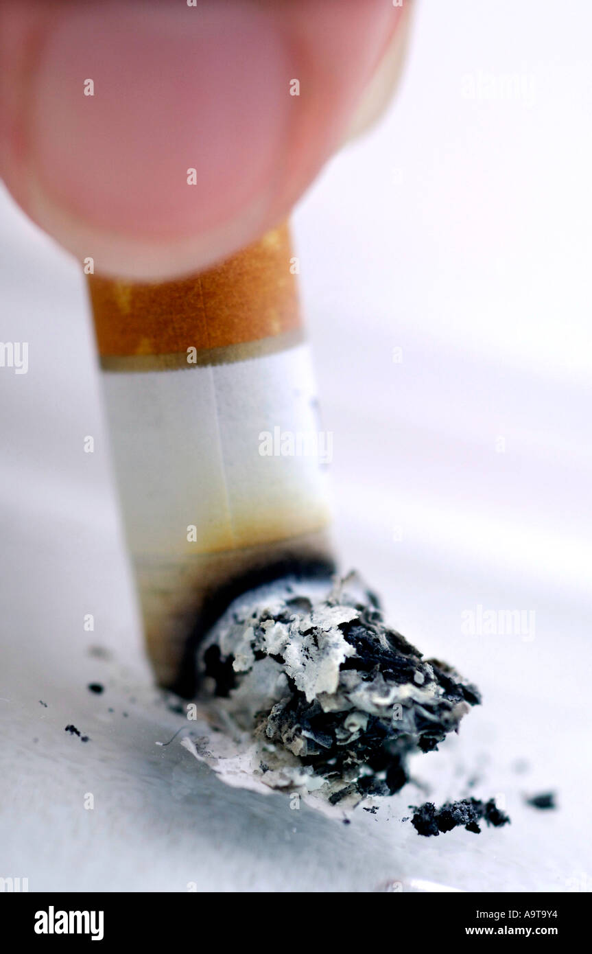 stubbing out a cigarette Stock Photo - Alamy
