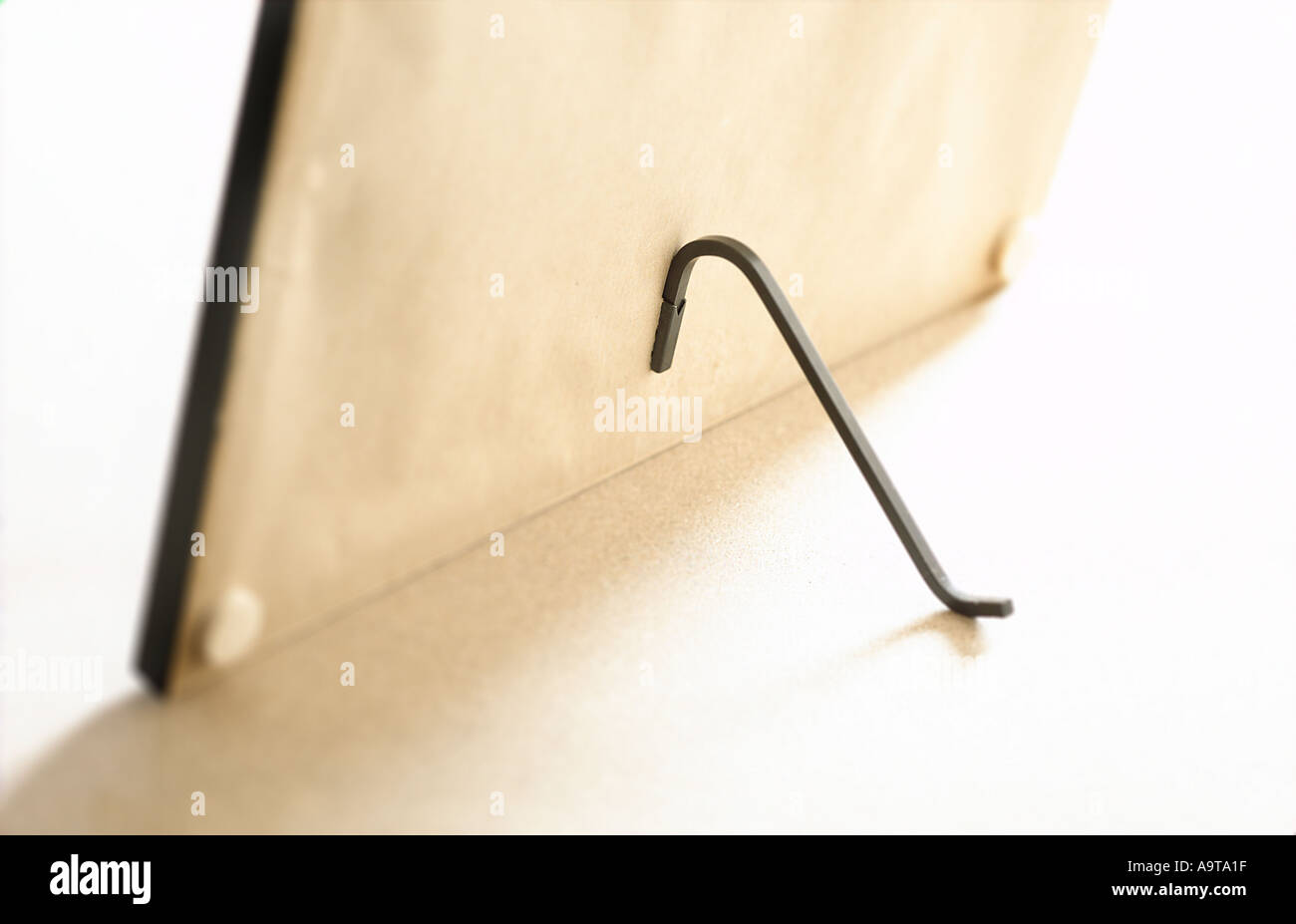 back of standing picture frame with front away from person out of view ...