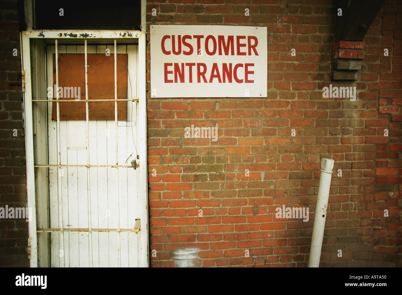 An uninviting customer entrance Stock Photo - Alamy