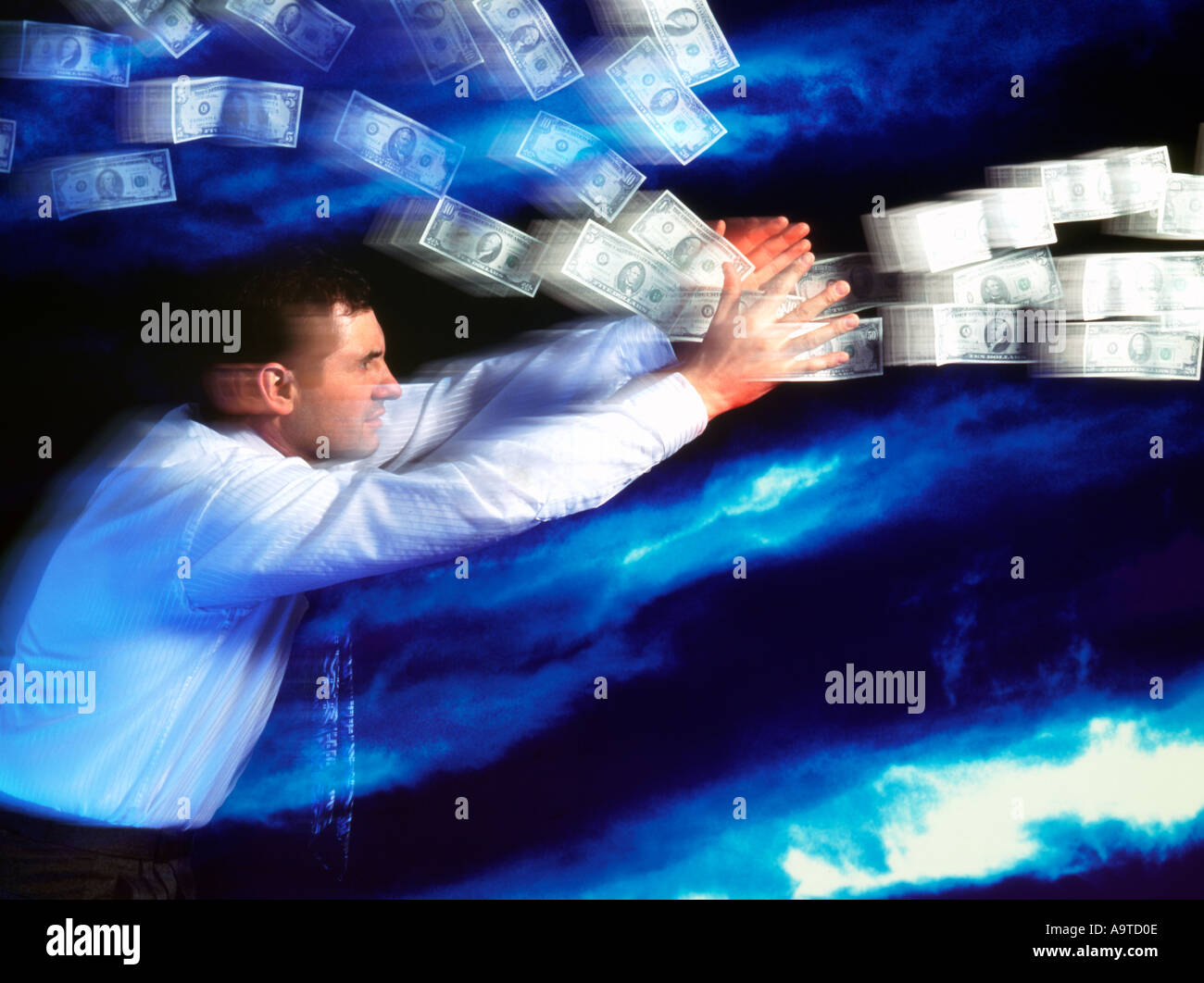 Money falling hi-res stock photography and images - Alamy
