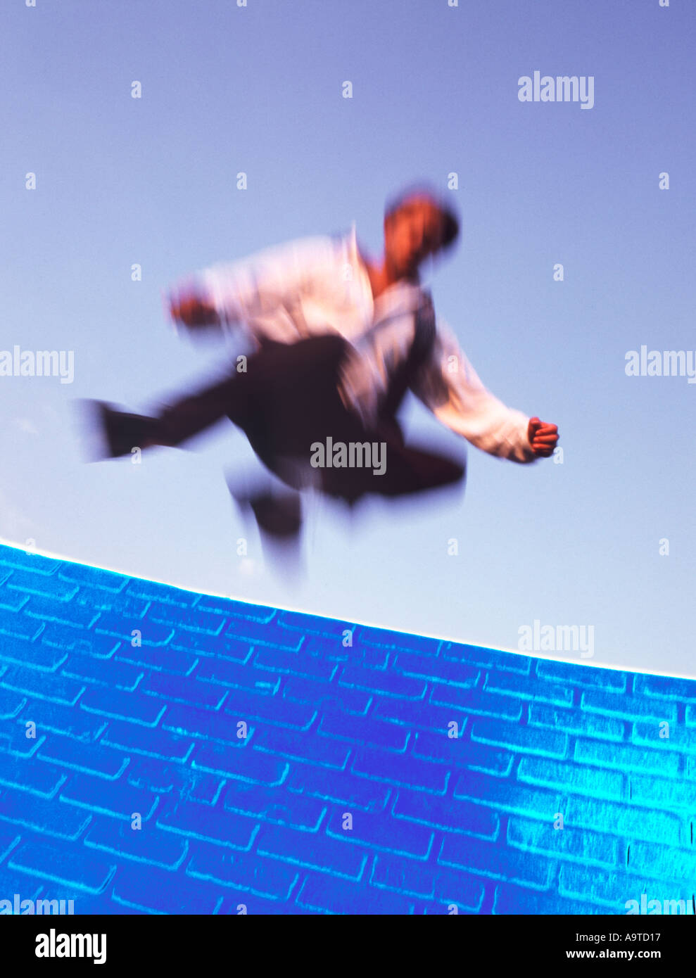 Man jumping over wall hi-res stock photography and images - Alamy
