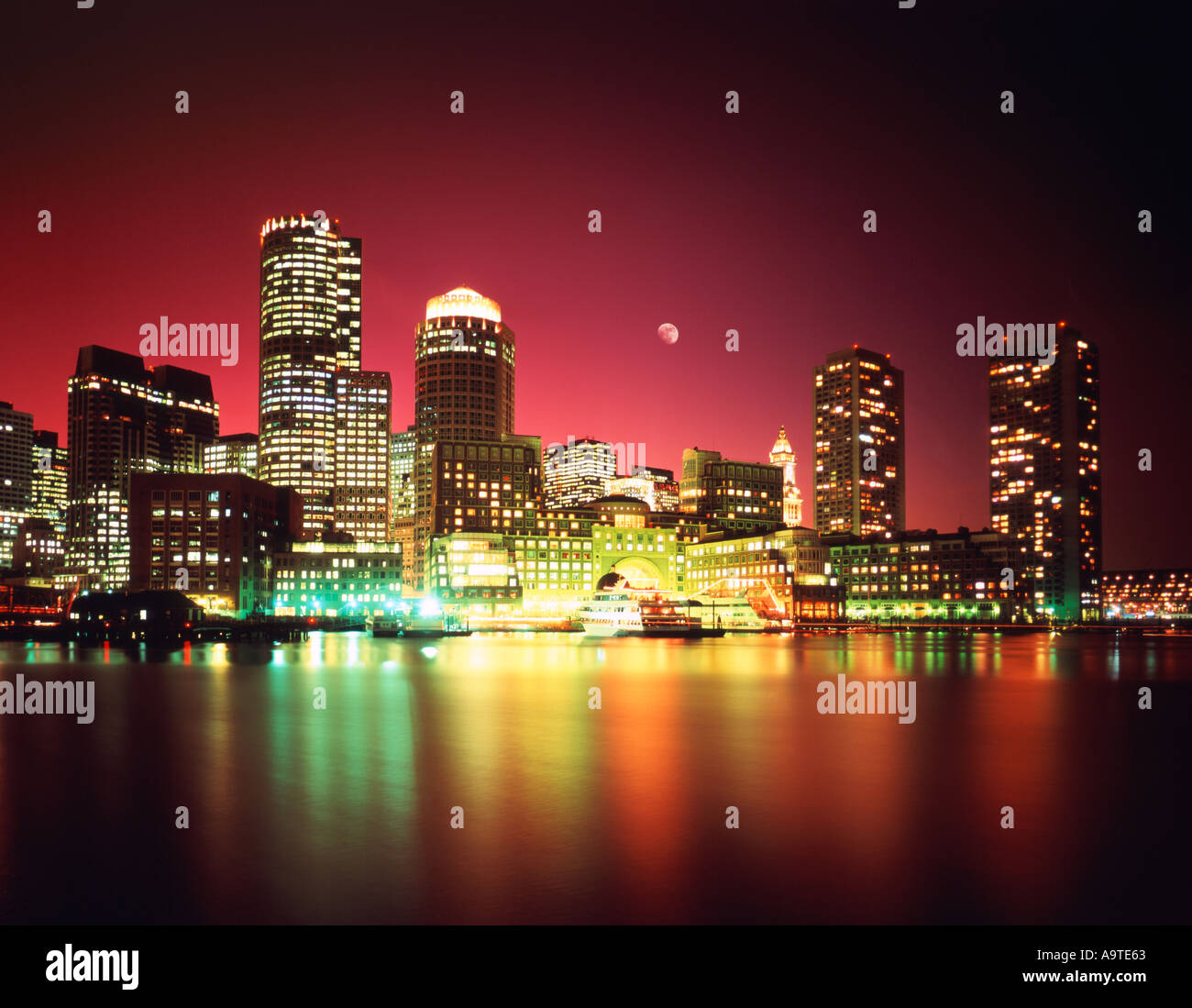 Boston skyline at night with moon Stock Photo - Alamy