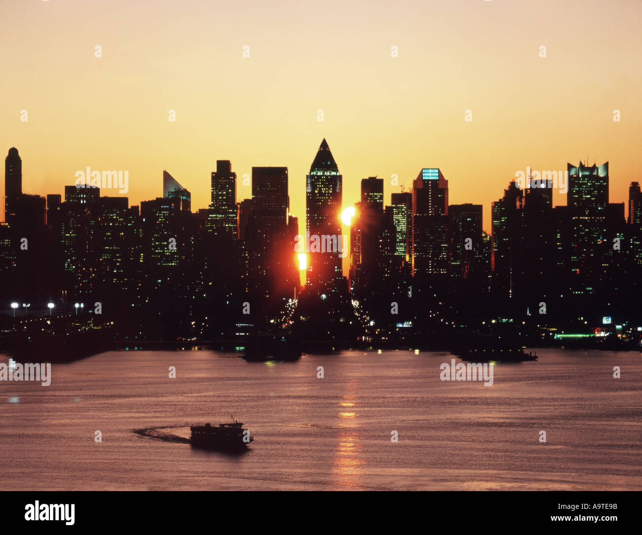 USA NYC Manhattan with 2 suns sunrise Stock Photo - Alamy