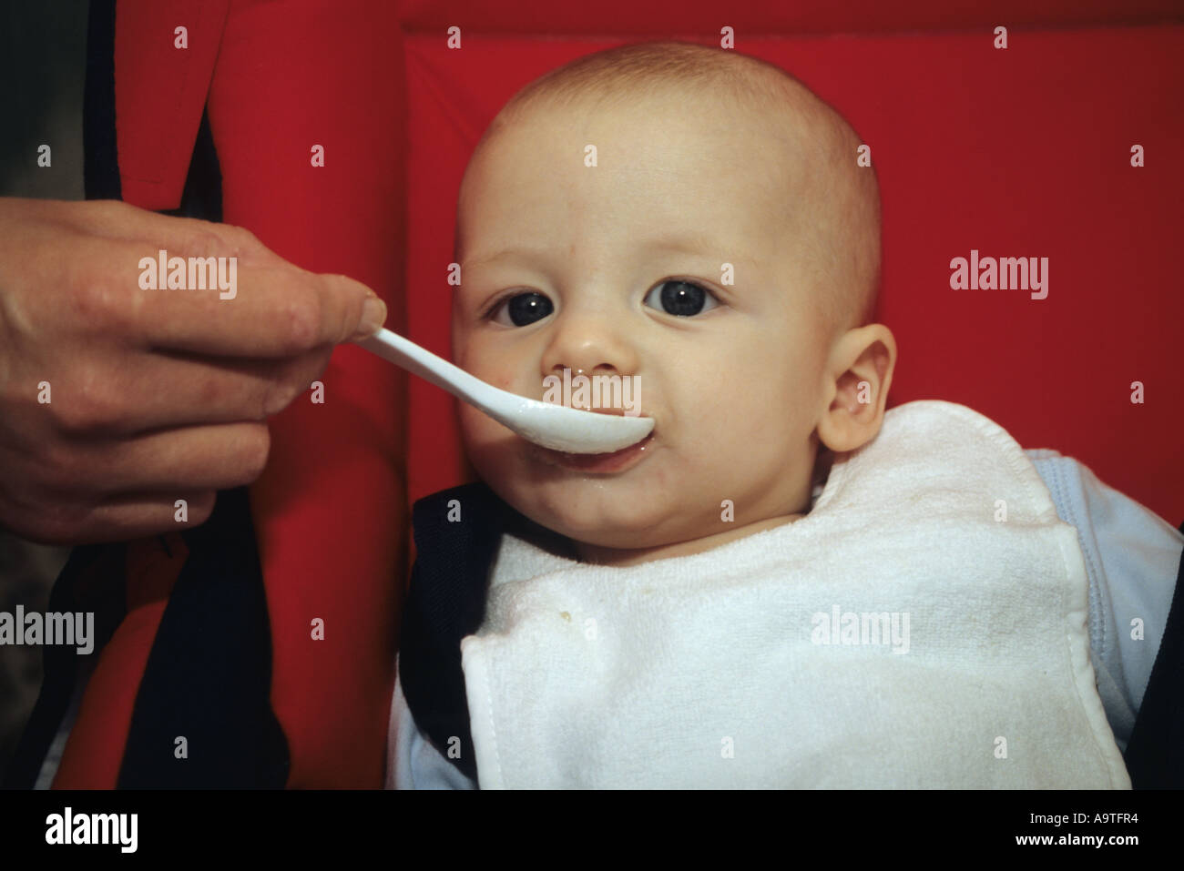 Baby Being Fed By Mother Stock Photo - Alamy