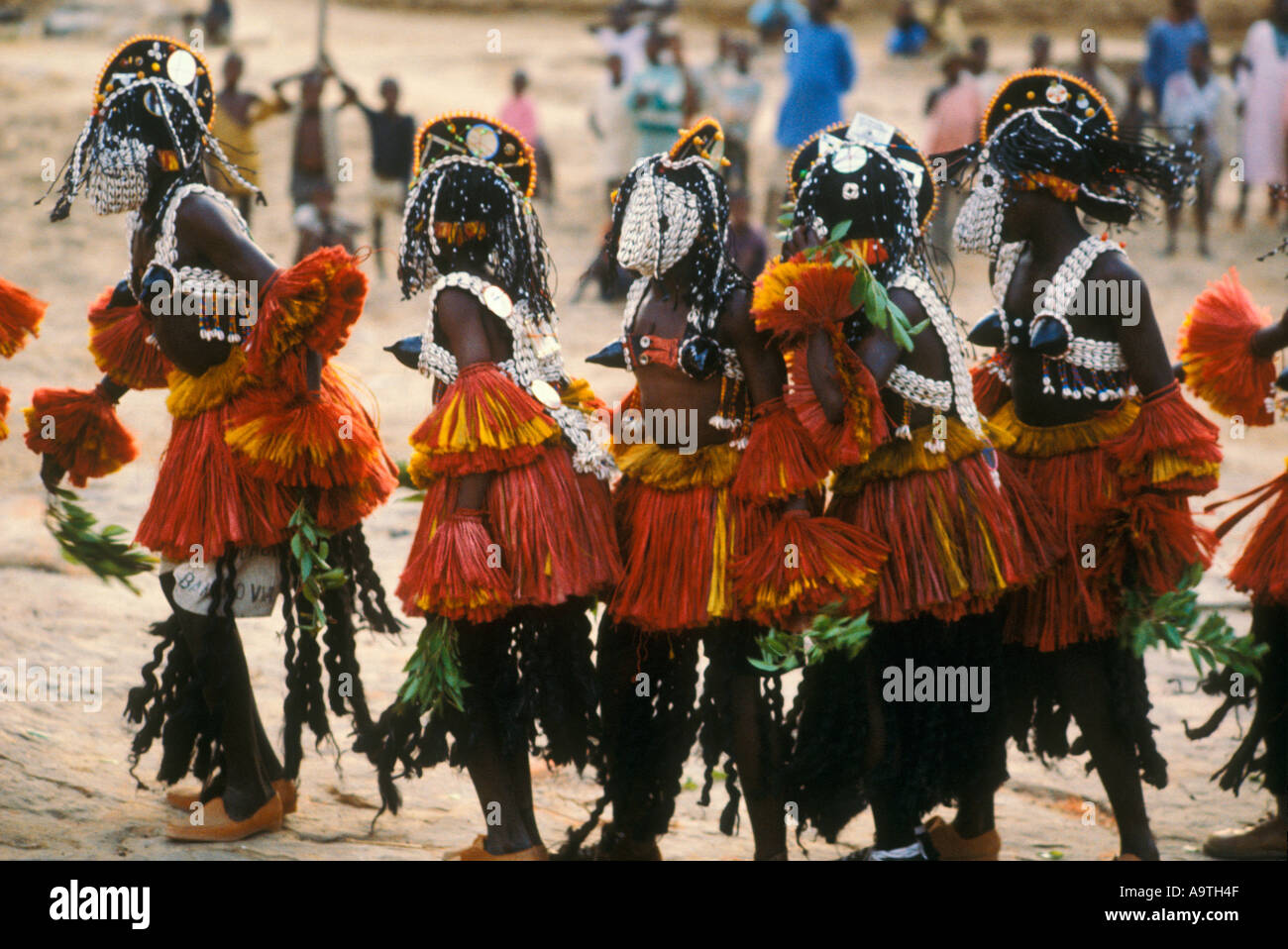 Dogon dancers wearing traditional masks and costumes Mali Stock Photo ...