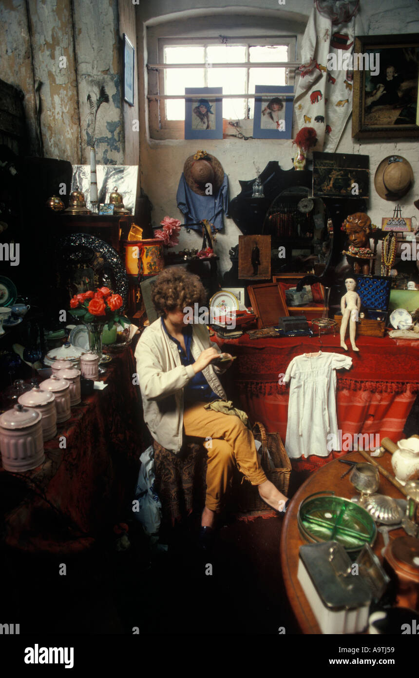 Market stall trader with display of her goods at Camden Lock market ...