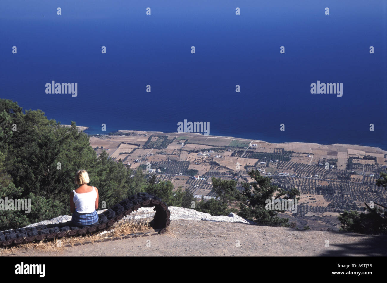 NORTH CYPRUS Woman sitting on tank track in the Kyrenia Range Stock ...