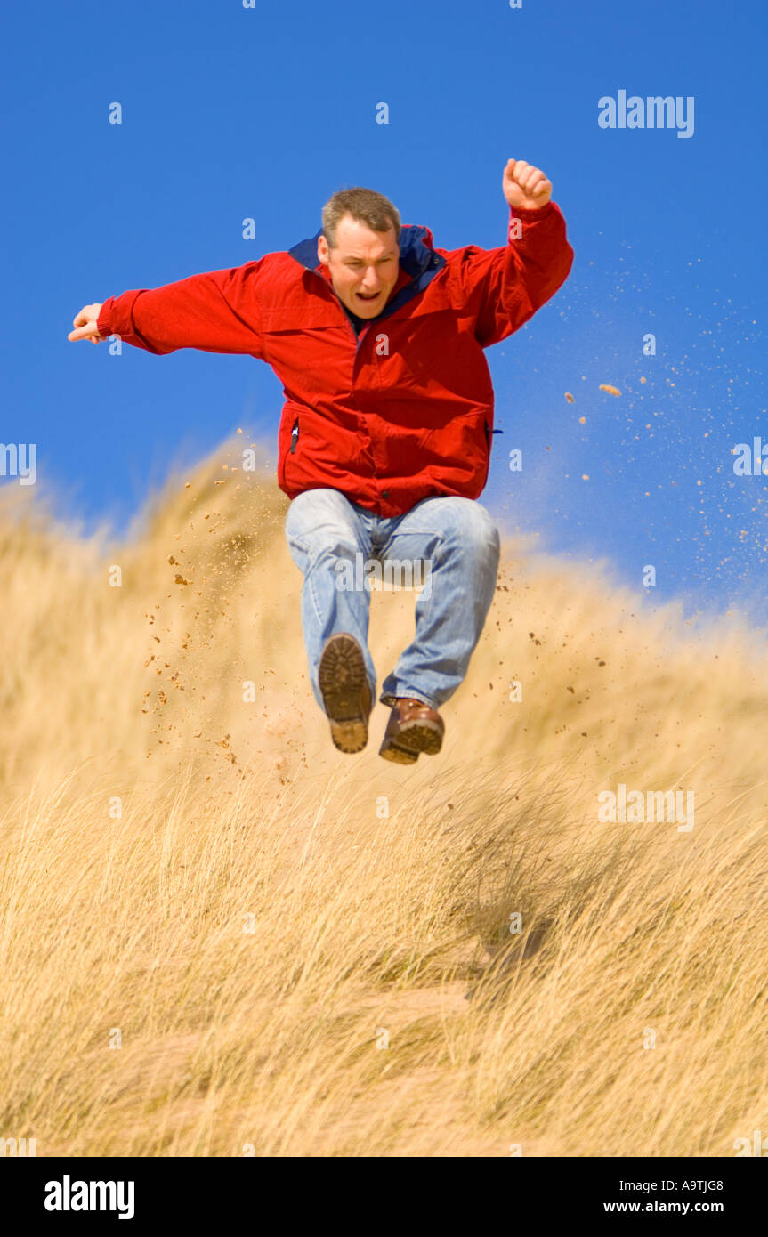 Jumping down sand dunes hi-res stock photography and images - Alamy