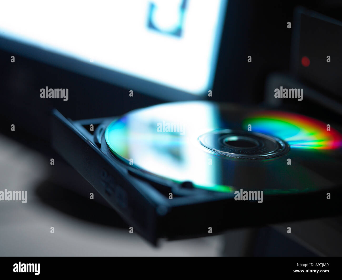 cd sitting in the tray of a dvd player on the computer Stock Photo - Alamy