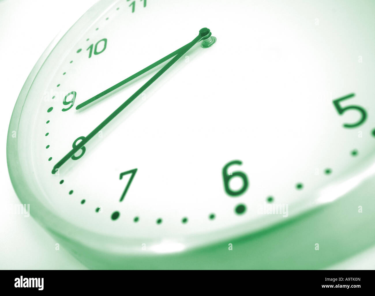 modern clock face tinged in green Stock Photo - Alamy