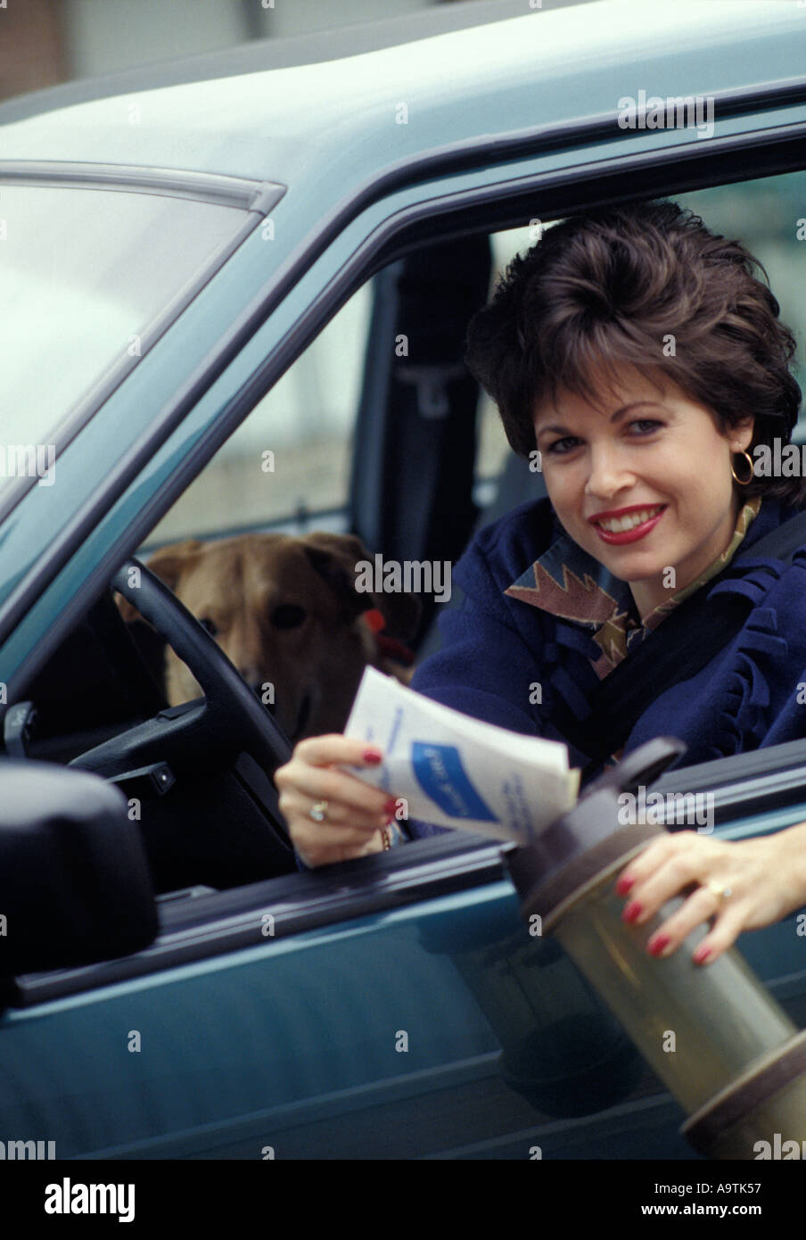 Female caucasian woman in car bank drive up window Stock Photo - Alamy