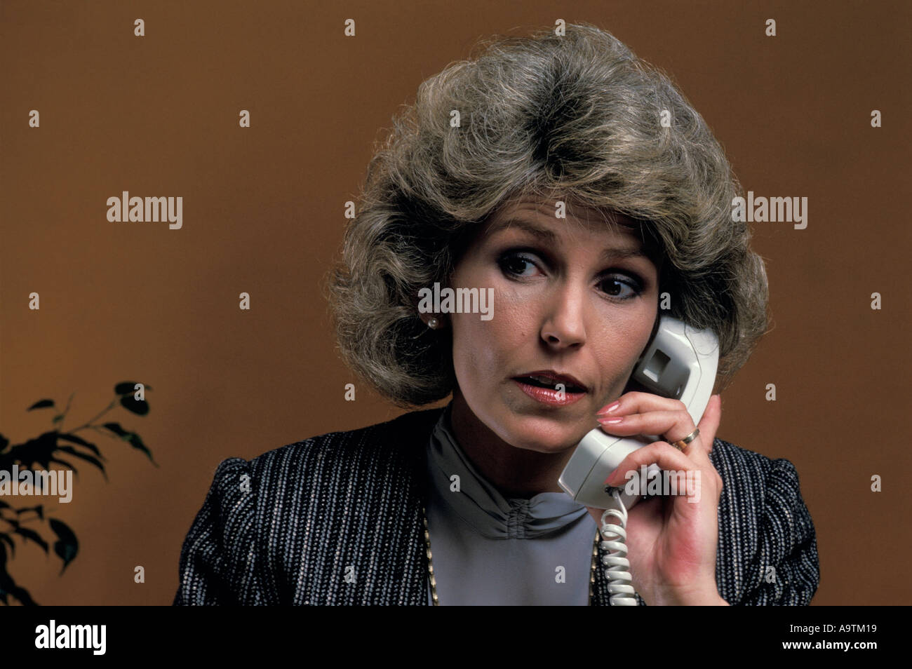 office interior female retirement home administrator on telephone copy ...