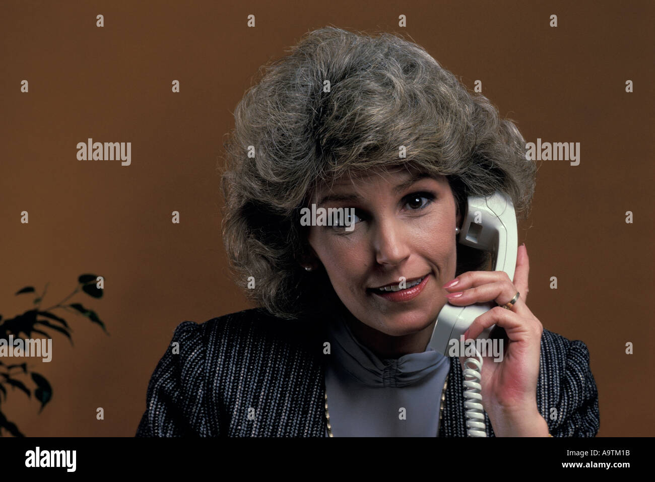 office interior female retirement home administrator on telephone copy ...