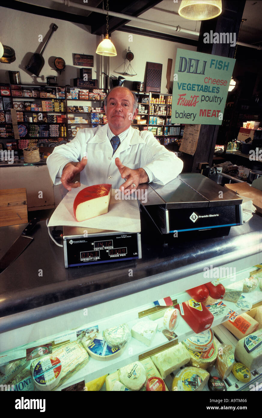 Male butcher deli worker owner in store Stock Photo - Alamy