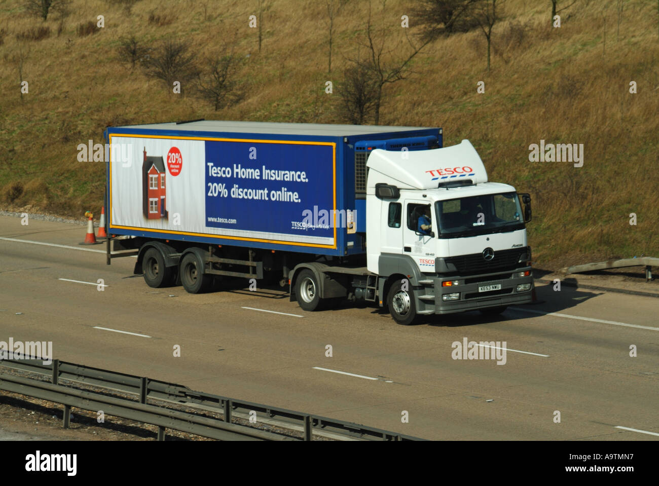 M25 motorway Tesco delivery lorry with advertising on trailer Stock ...