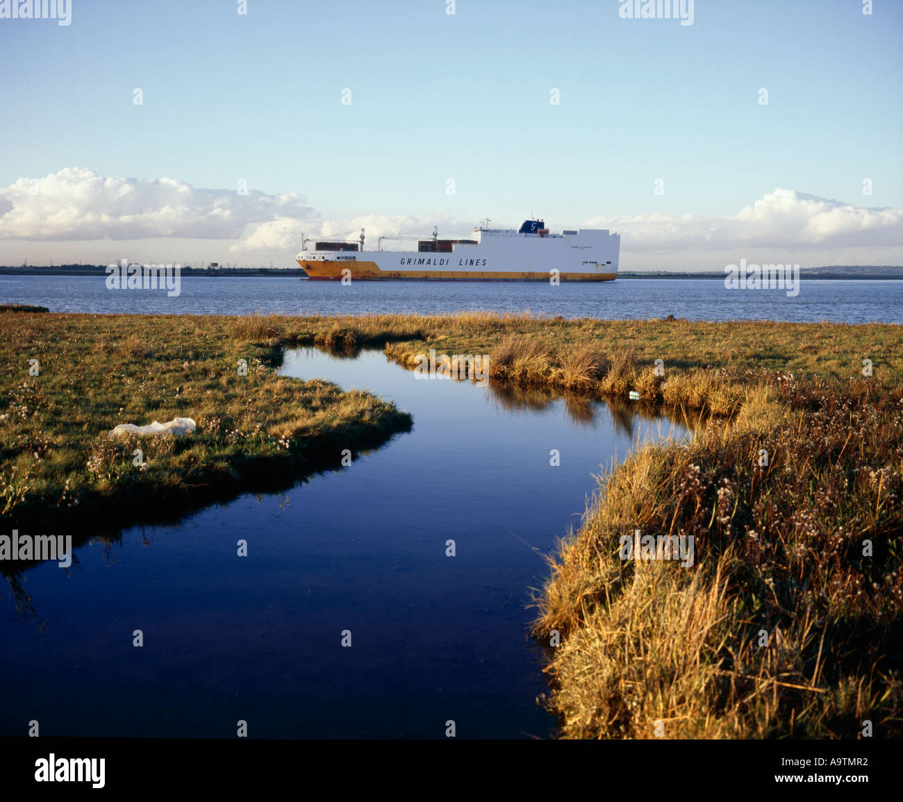 container ship heading up the river Thames near Higham Kent Stock Photo ...