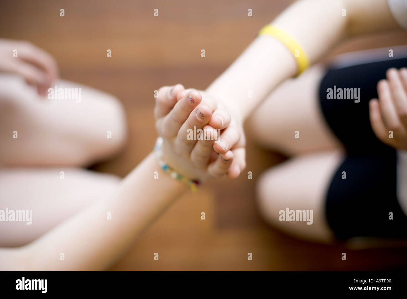 Two girls playing hand clapping game at school Stock Photo - Alamy