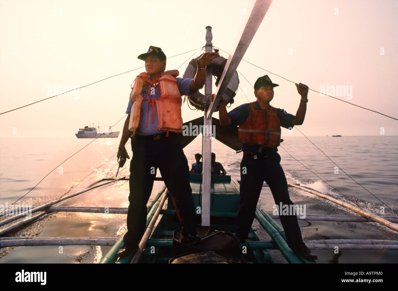 The Philippines Philippines coast guard at work inspecting boats and ...