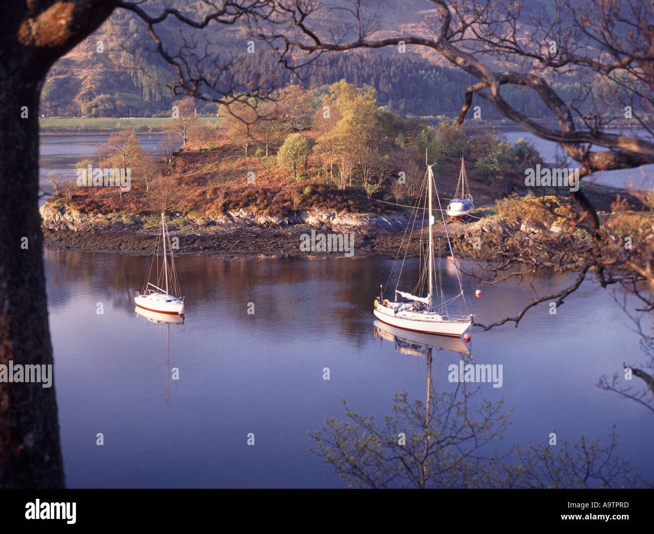 Boats & reflection still water of Loch Leven early Spring Scottish ...