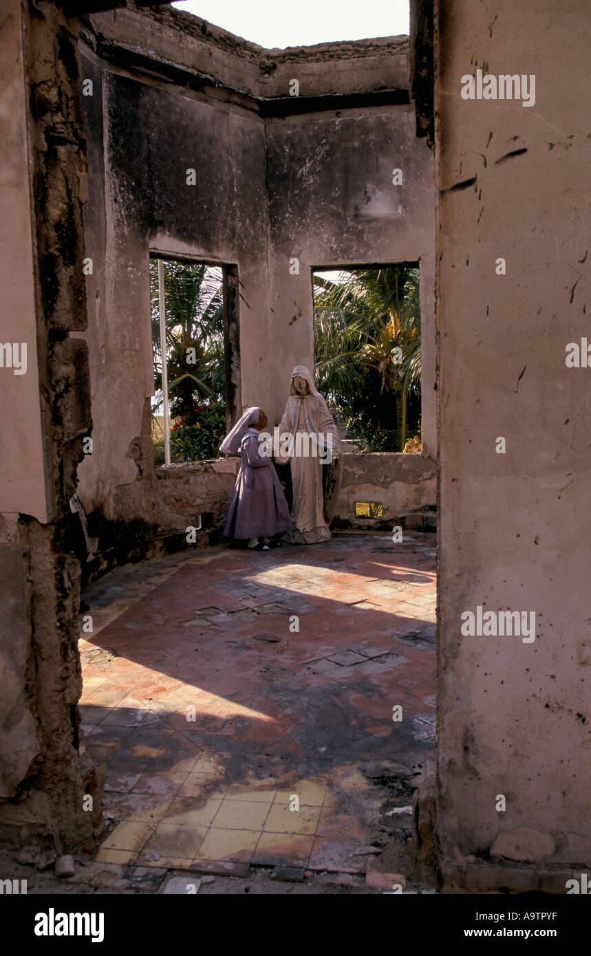 'EAST TIMOR SEPT/OCT 1999', SISTER ERMALINDA STANDS BY THE STATUE OF ...
