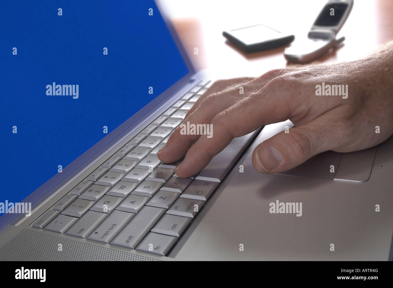 Computer Laptop With Hand And Mobile Cell Phone, PDA, USA Stock Photo ...