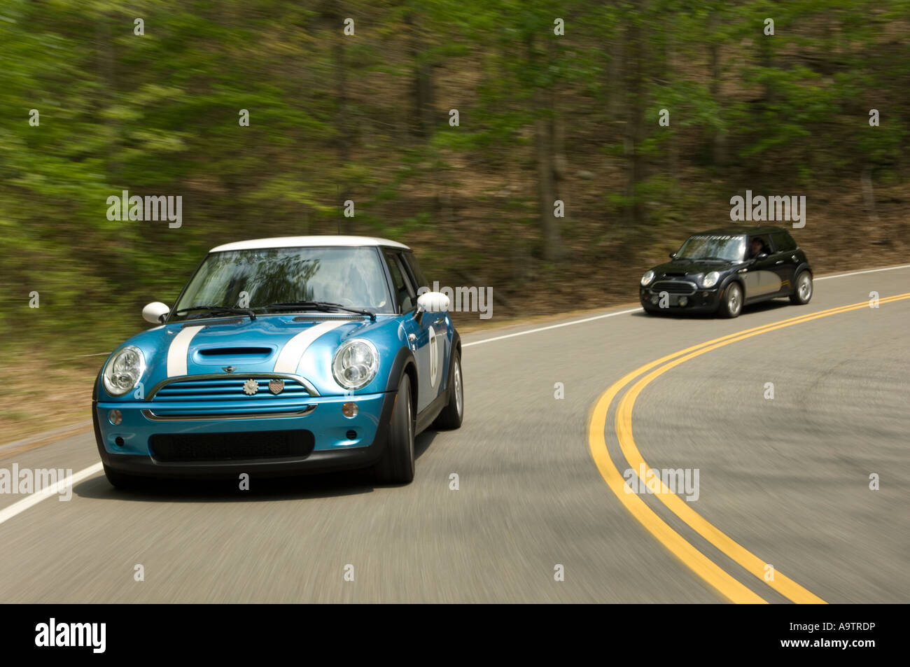 Two MINI Coopers a winding road Stock Photo - Alamy