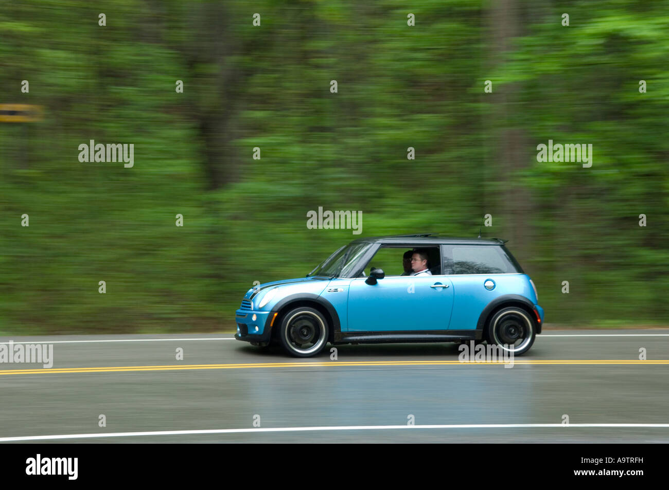 MINI Cooper S on a wet rural road Stock Photo - Alamy