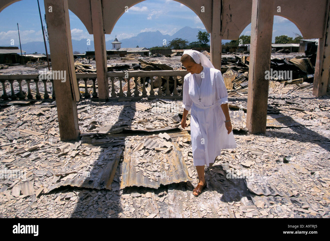 Woman walks through destruction hi-res stock photography and images - Alamy