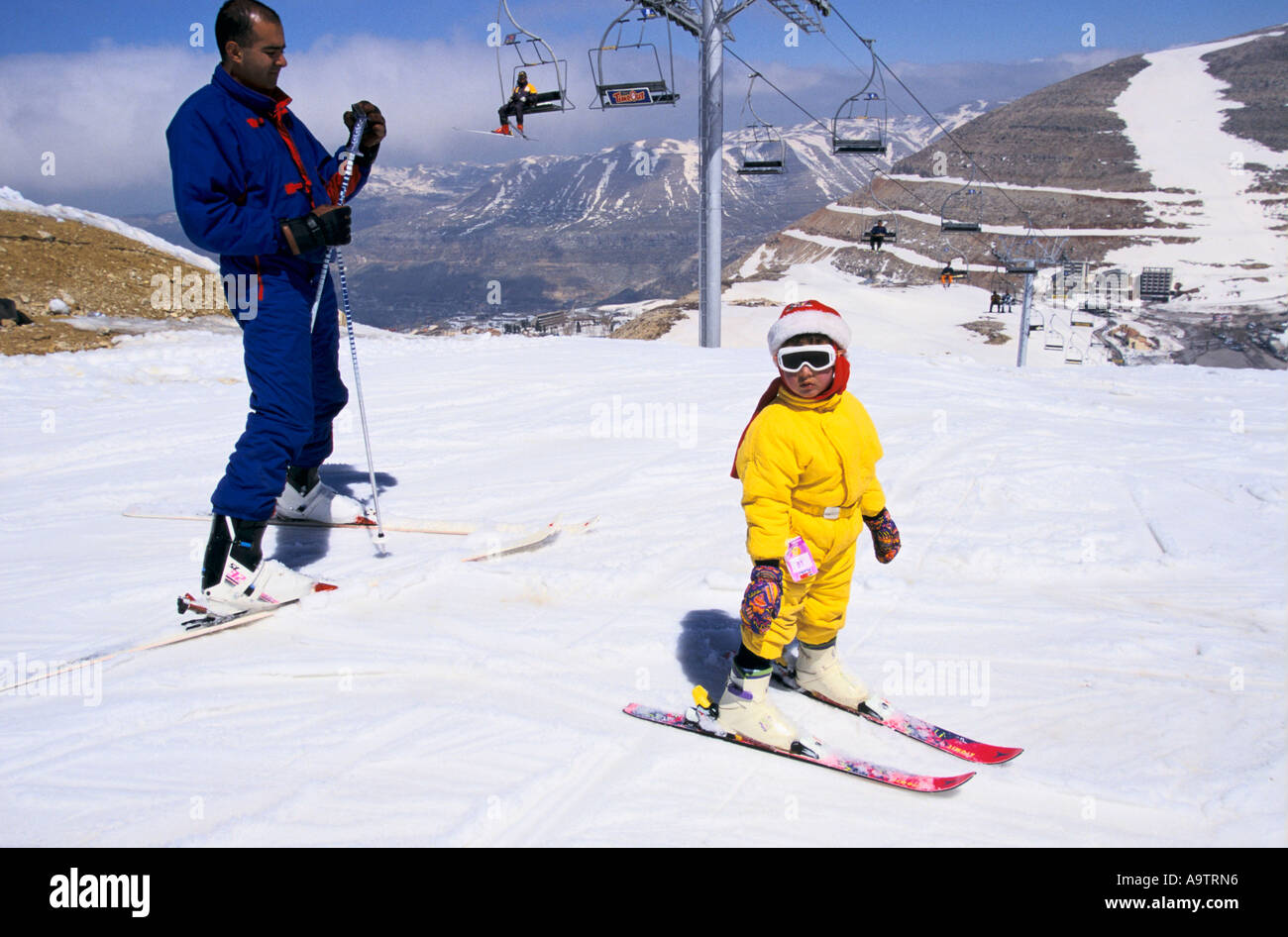 BEIRUT FARAYA MZAAR SKI RESORT A father with his son at the top of one ...