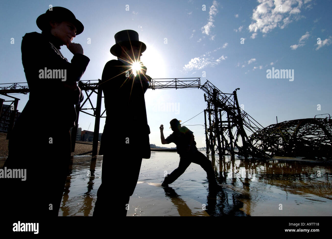 Stone skimming competition on Brighton Beach. A contender lobs a stone ...