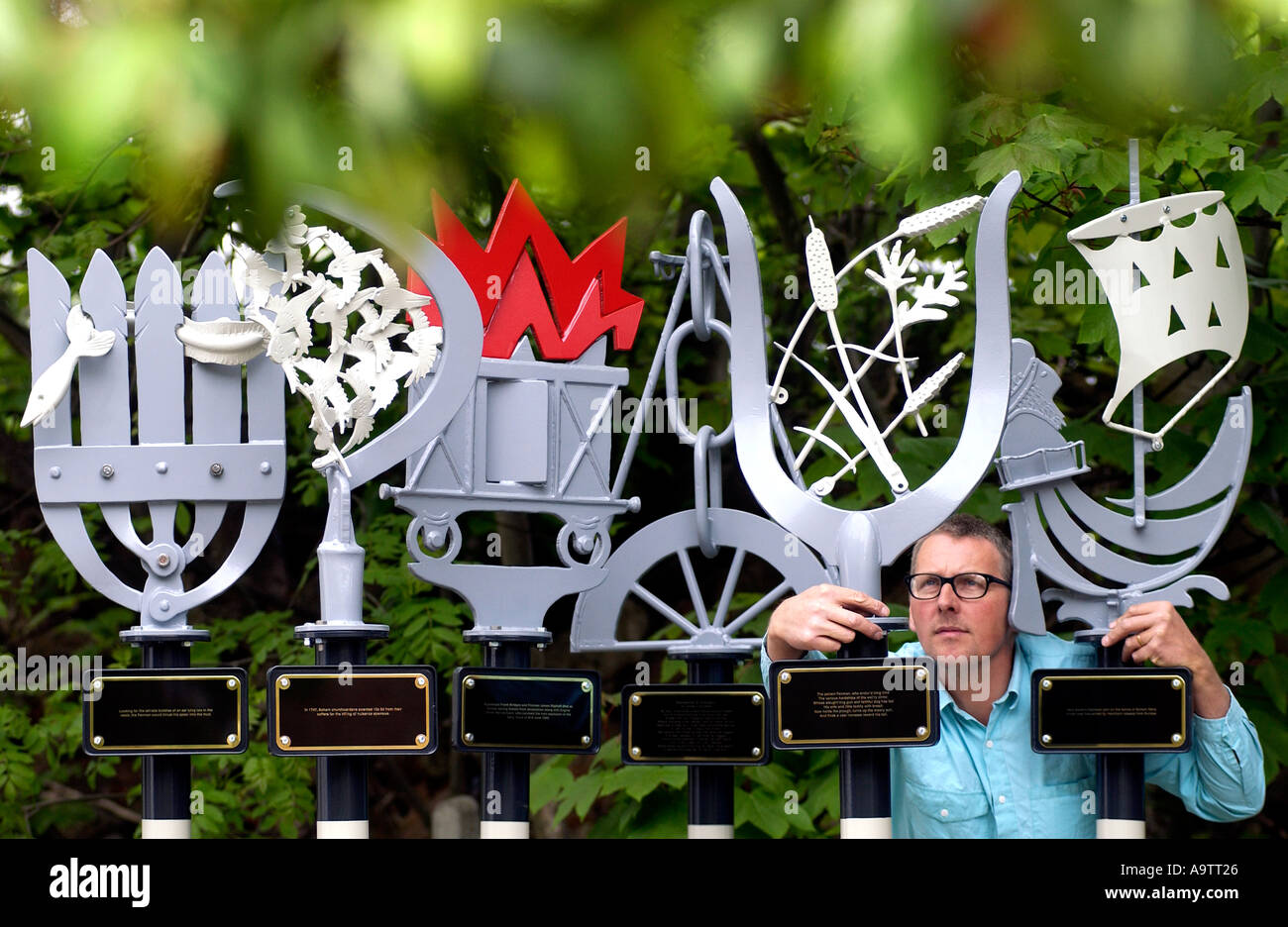 A sculptor with a series of Waymarkers for footpath junctions ...