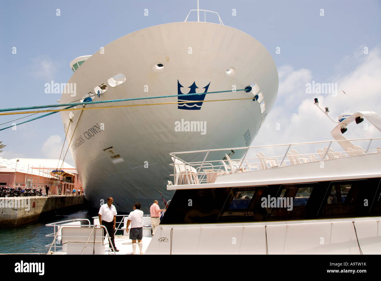 Bermuda Hamilton ferry in front of cruise ship size contrast ...