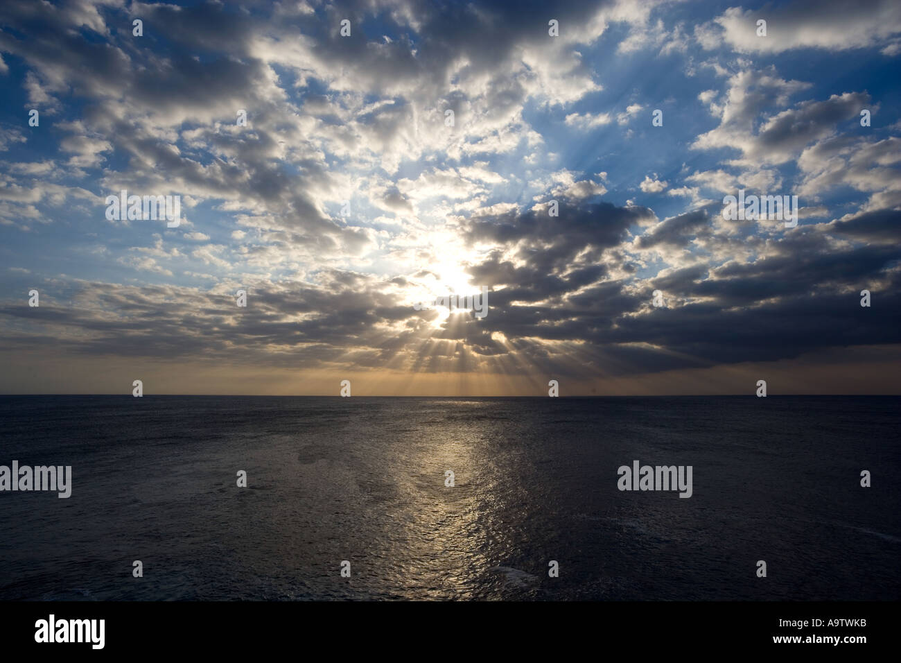Sunset over ocean Stock Photo - Alamy