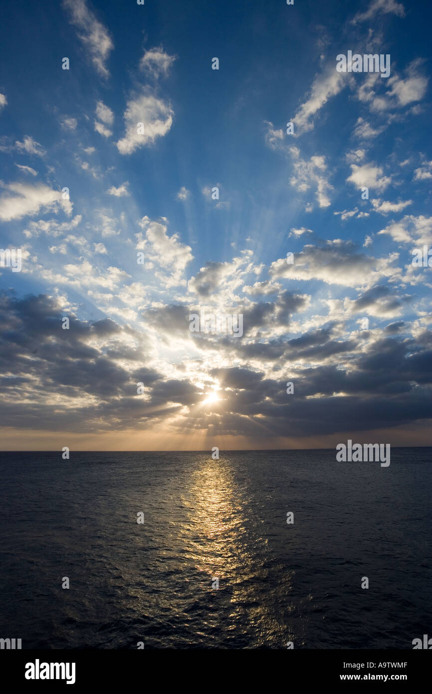 Sunset over ocean Stock Photo - Alamy
