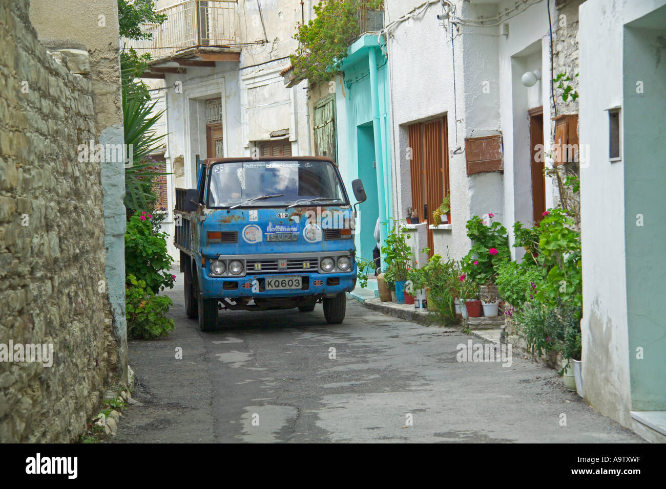 van driving in village street Stock Photo - Alamy