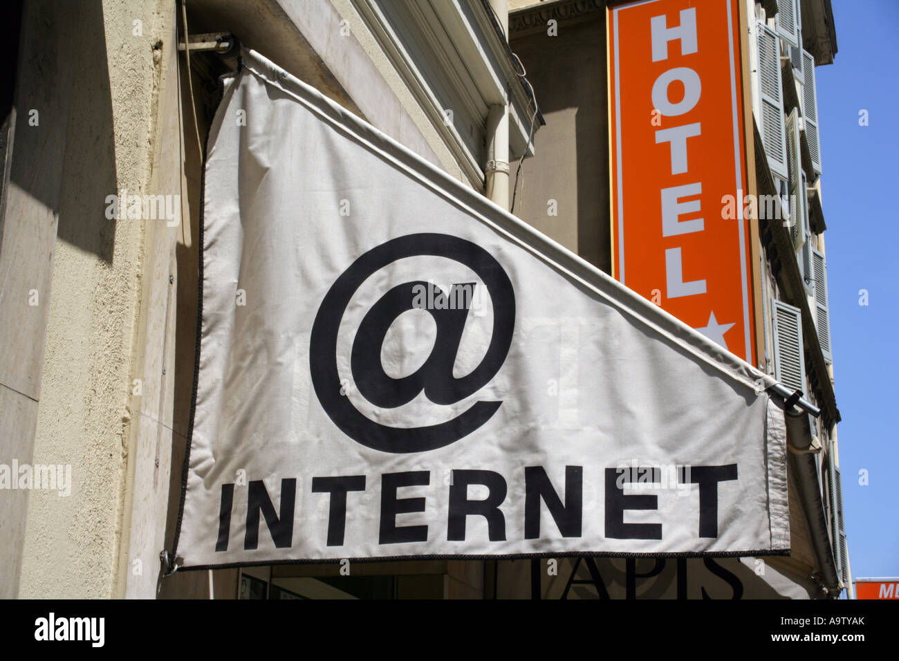 Internet cafe and hotel signs, Nice France Stock Photo - Alamy
