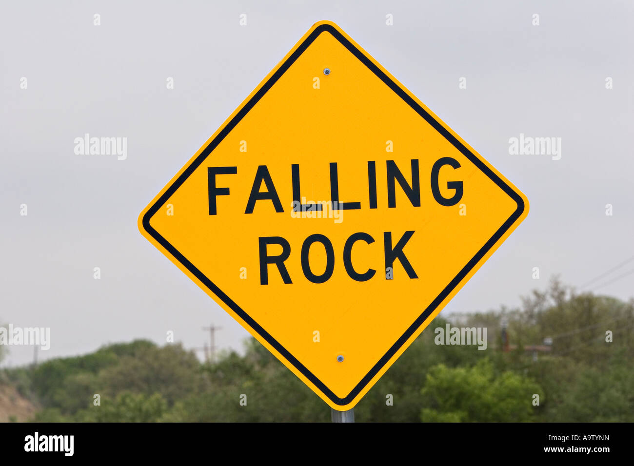 Road sign warning of falling rock Stock Photo - Alamy